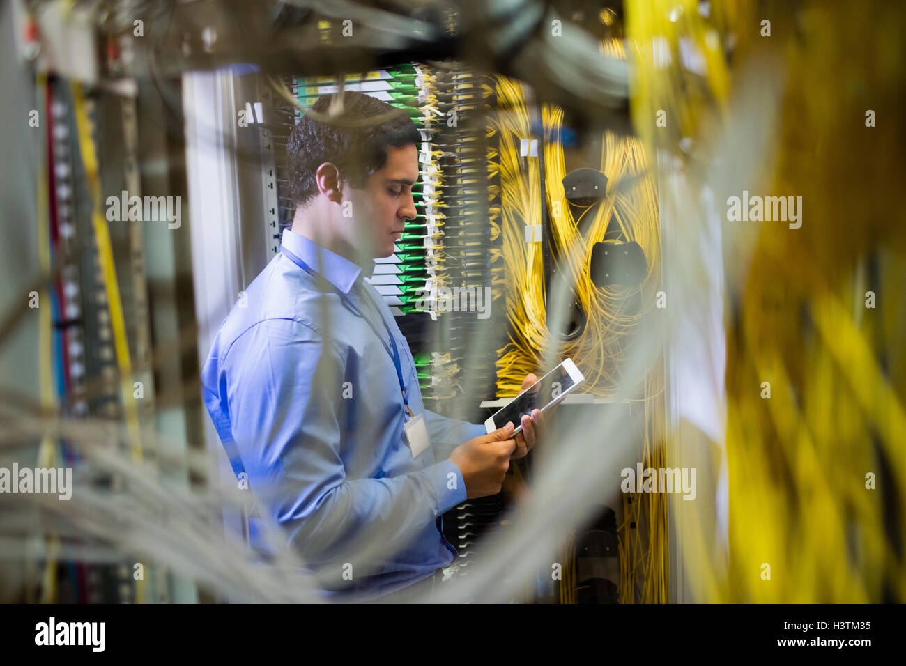 Technician using digital tablet Stock Photo - Alamy