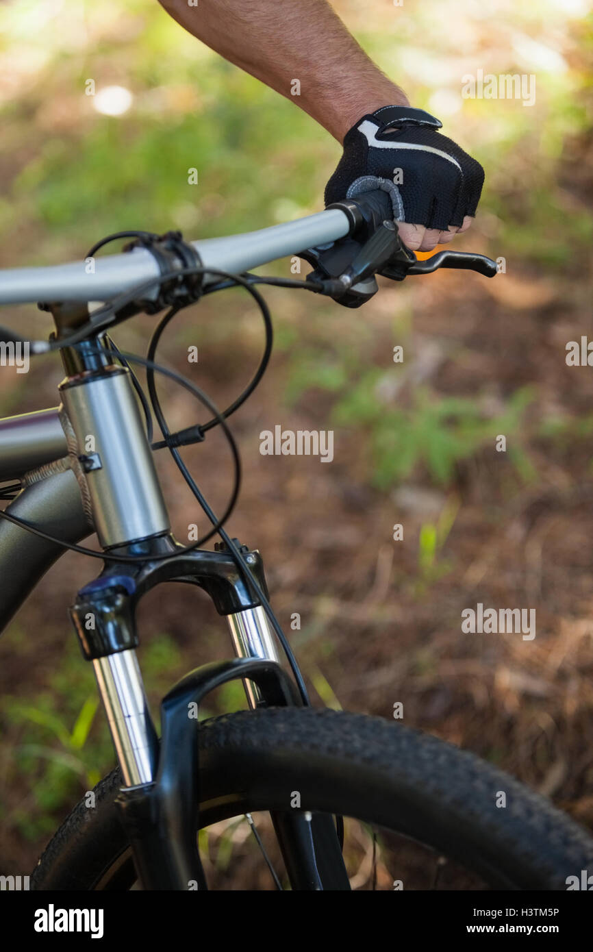 Close-up of male mountain biker riding bicycle Stock Photo - Alamy