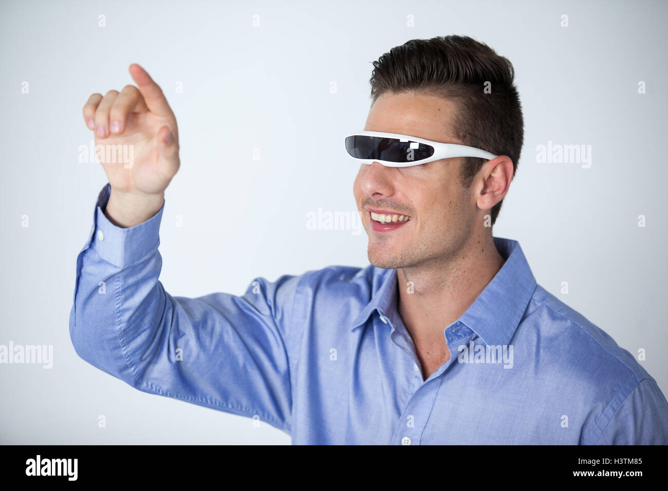 Man using virtual video glasses Stock Photo - Alamy