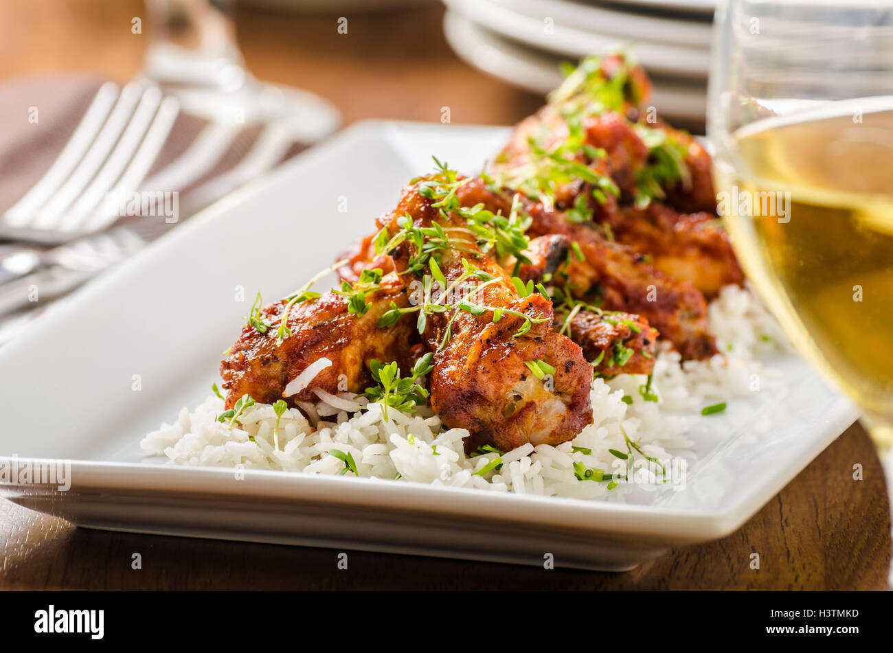 Grilled chicken wings Hot wings with basmati rice, topped with ...