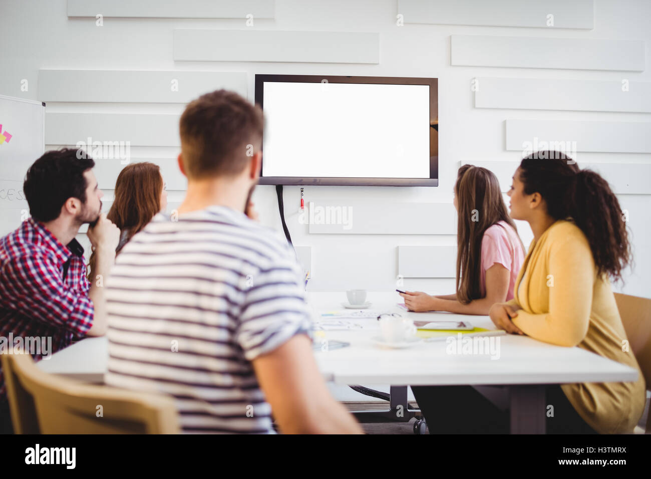 Woman working man watching tv hi-res stock photography and images - Alamy