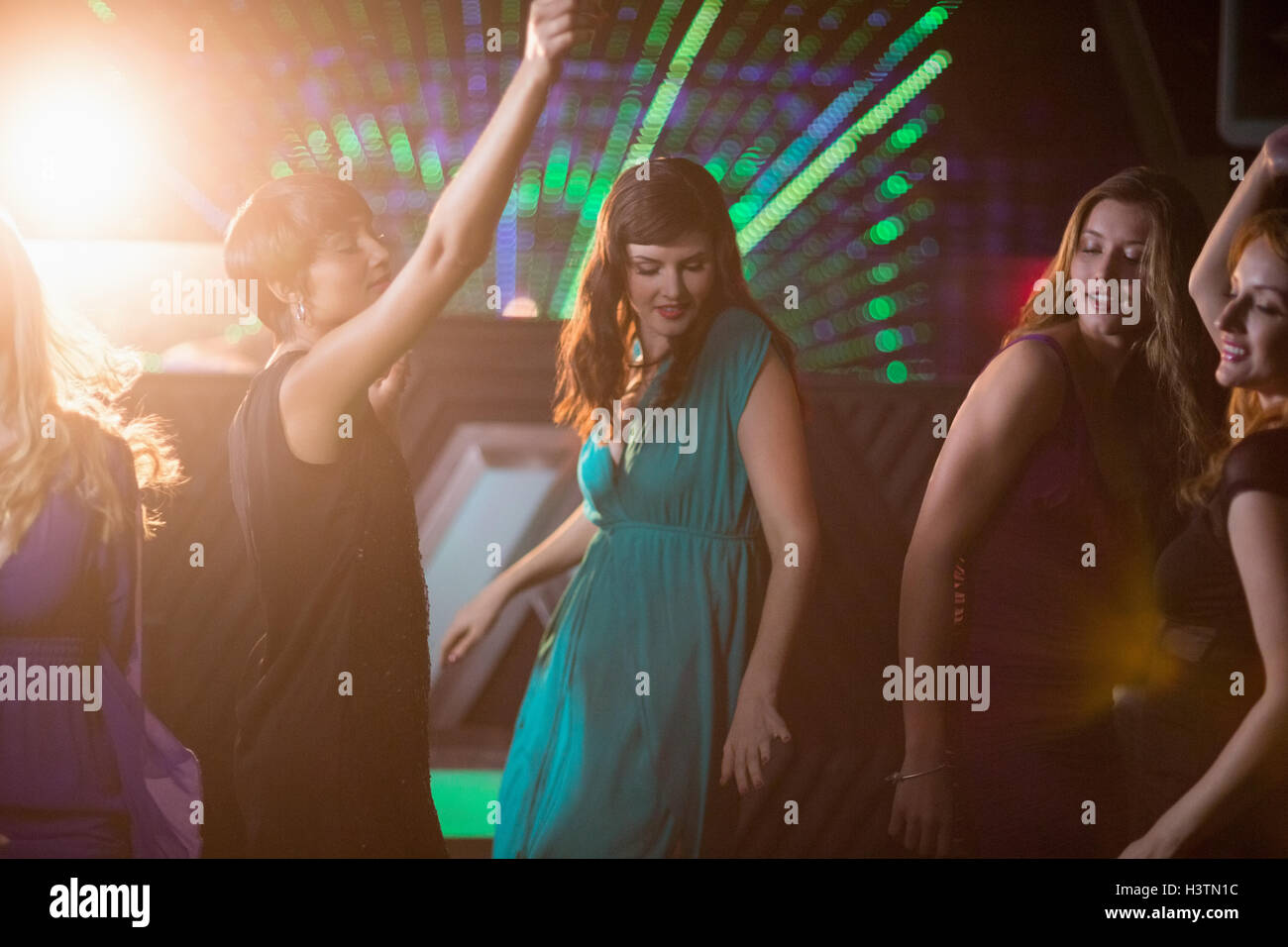 Group of smiling friends dancing on dance floor Stock Photo - Alamy