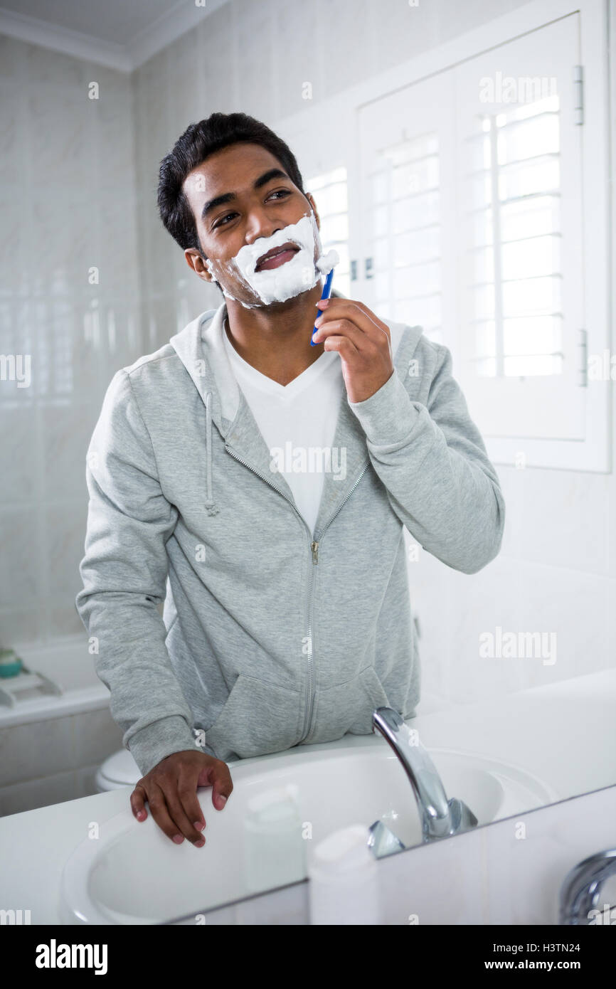 Man shaving in the bathroom Stock Photo - Alamy