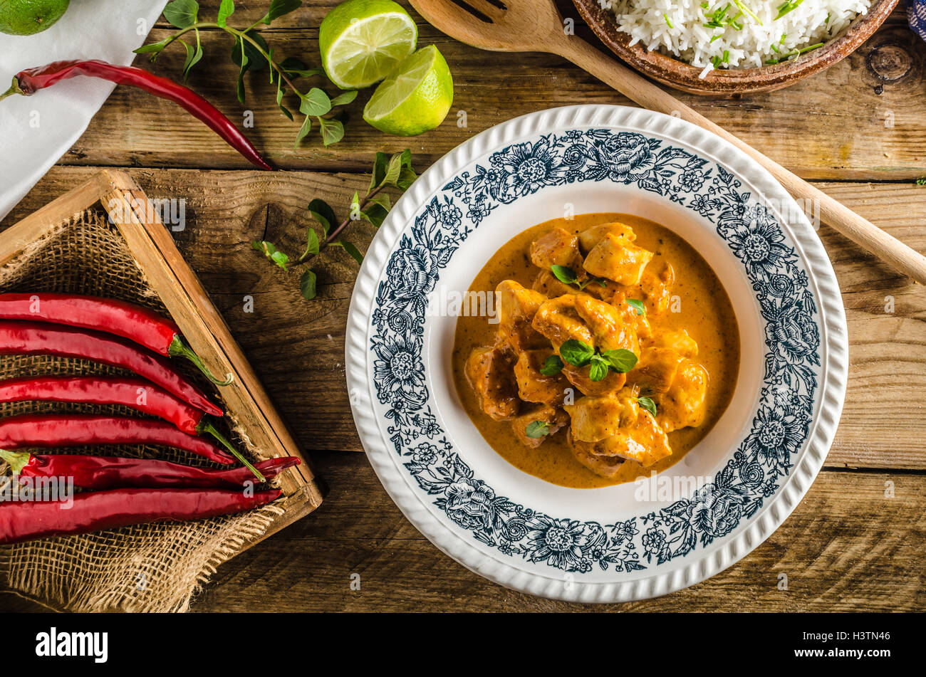Curry chicken with basmati rice, delicious and spicy food, fresh herbs ...