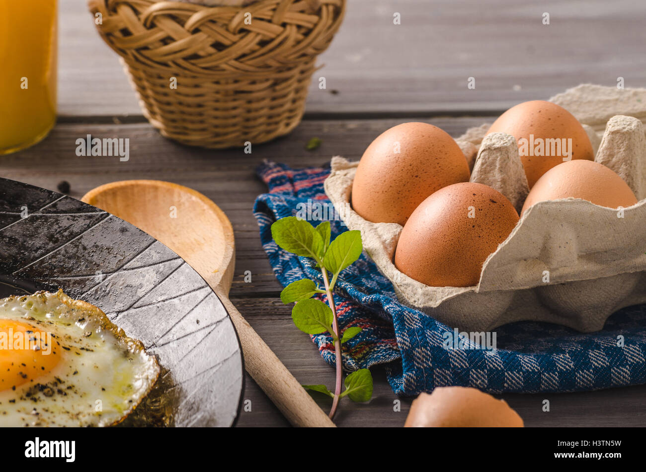 Eggs fried rustic style, bio eggs with white bread Stock Photo - Alamy