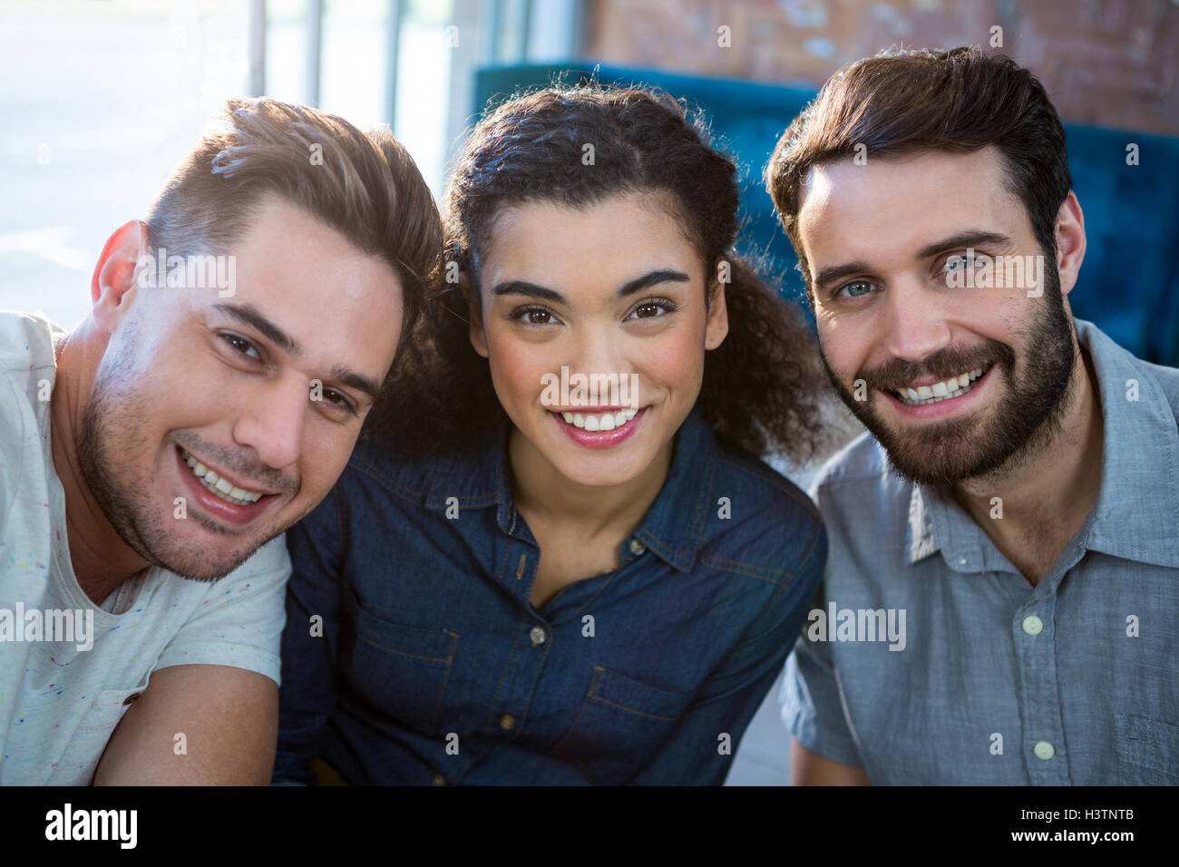 Portrait of three smiling friends Stock Photo - Alamy