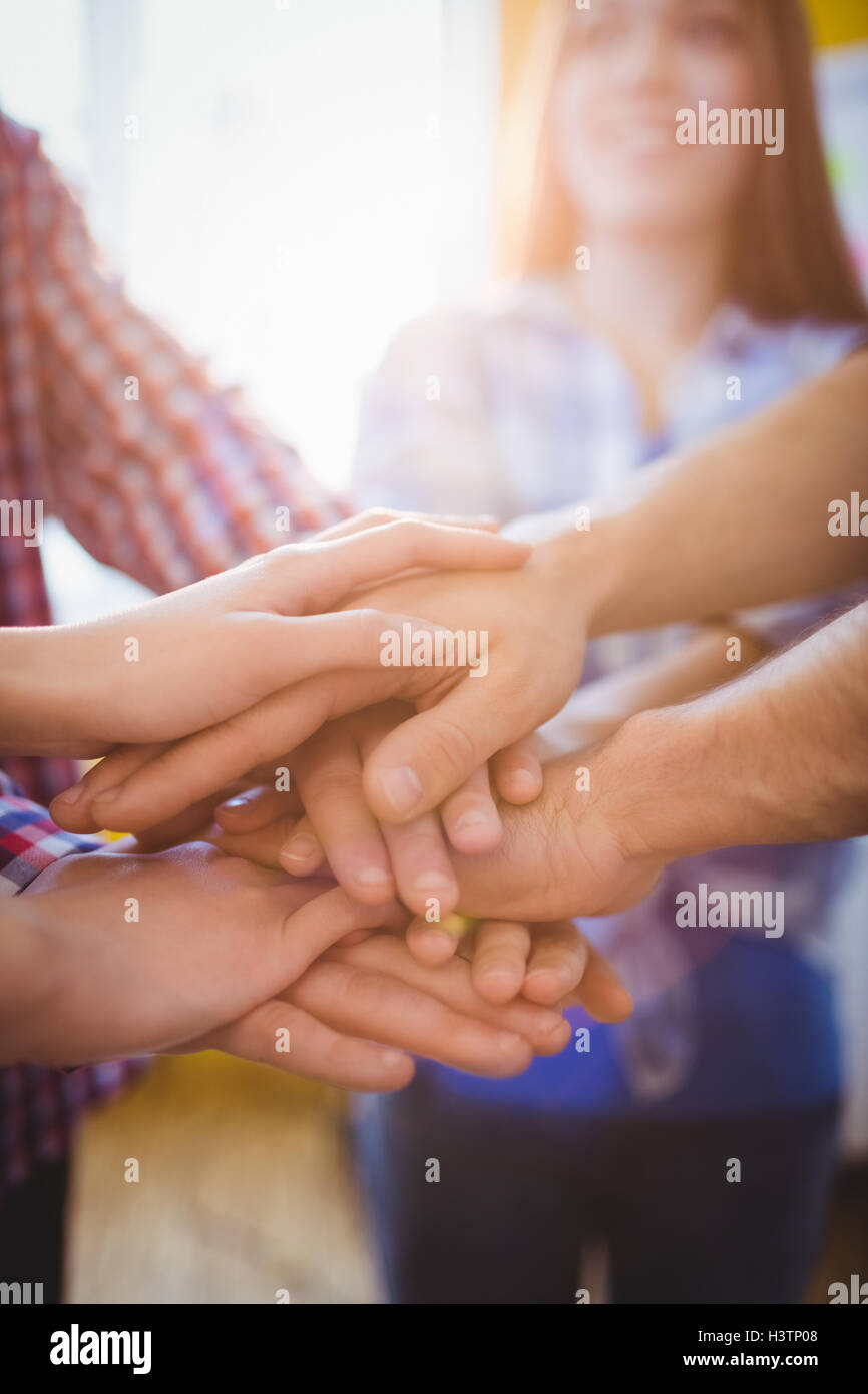Creative business people stacking hands Stock Photo - Alamy
