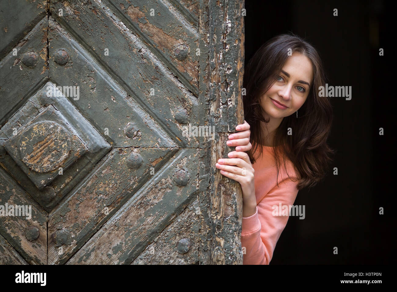 Girl by wooden gate hi-res stock photography and images - Alamy