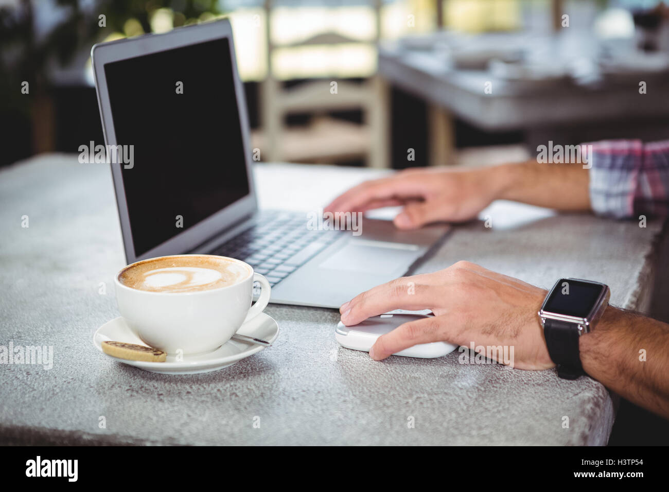 Hands of man using laptop Stock Photo - Alamy