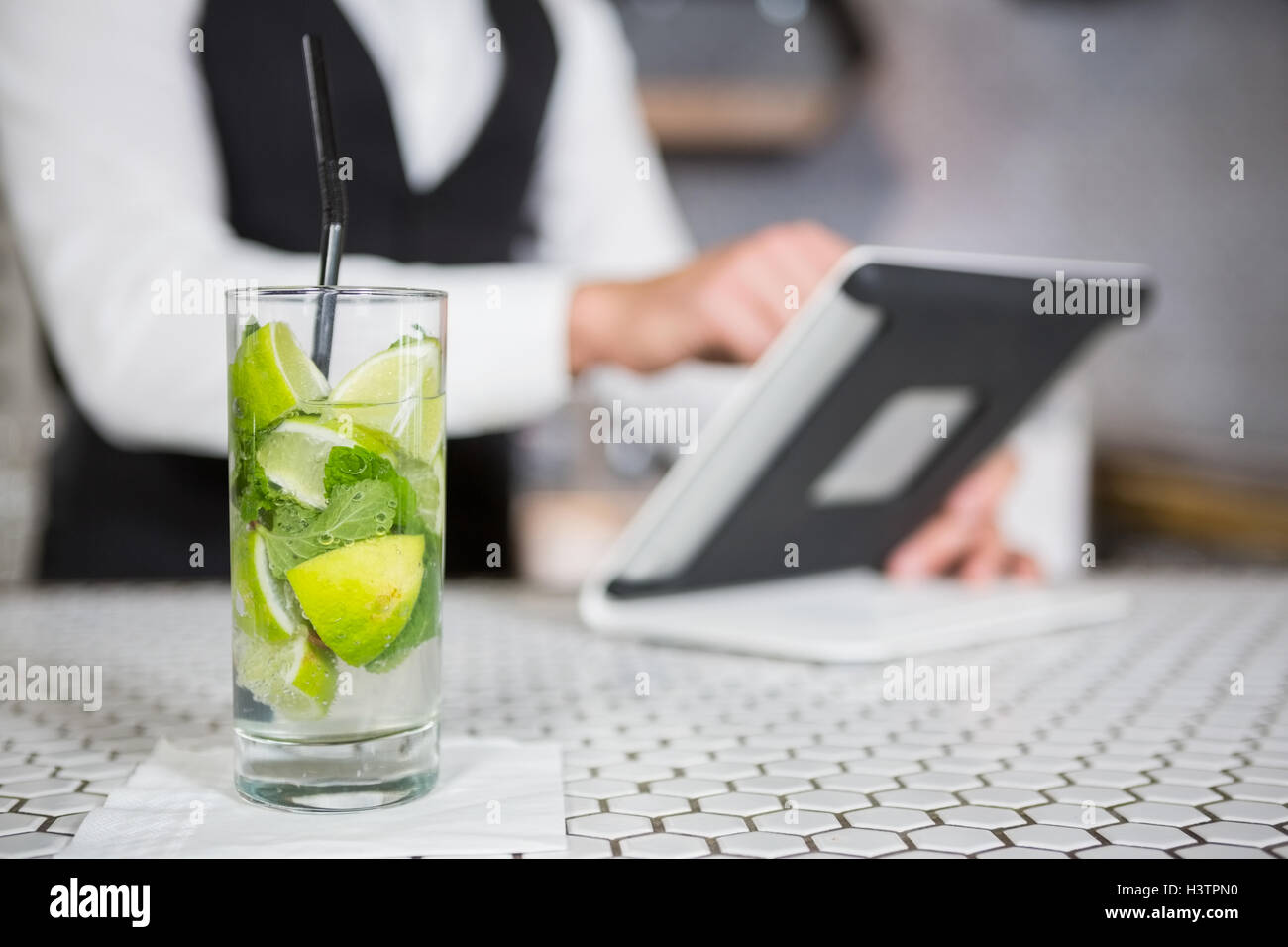 Glass of mojito on a bar counter Stock Photo - Alamy