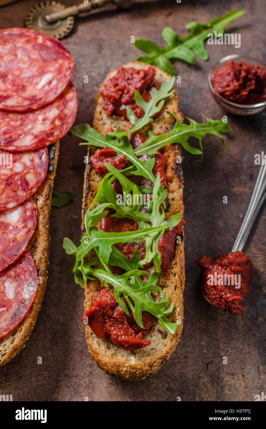 Rustic baguette with herbs, tomato sauce and hot italian sausage ...