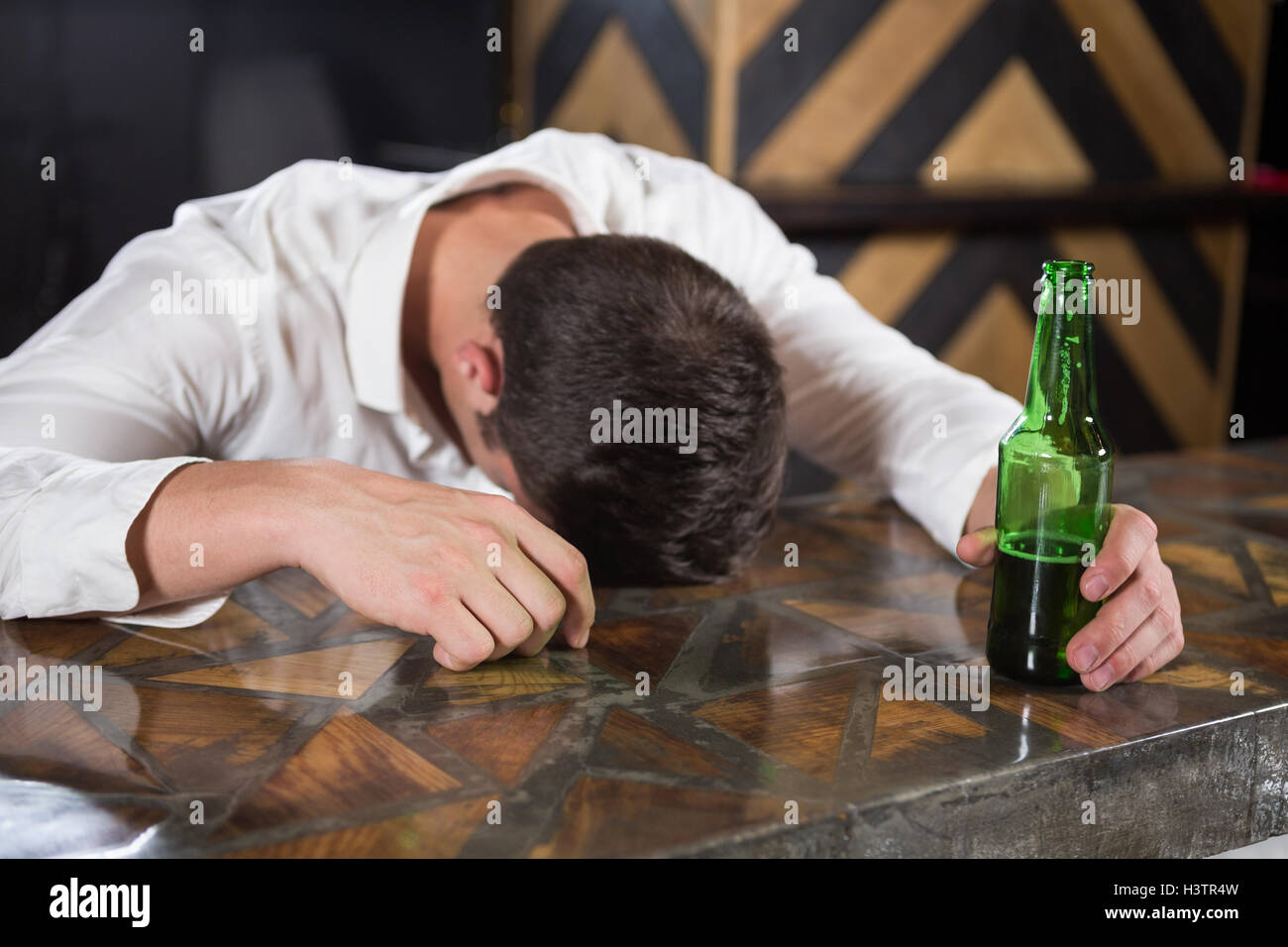 Drunk man bottle beer lying hi-res stock photography and images - Alamy