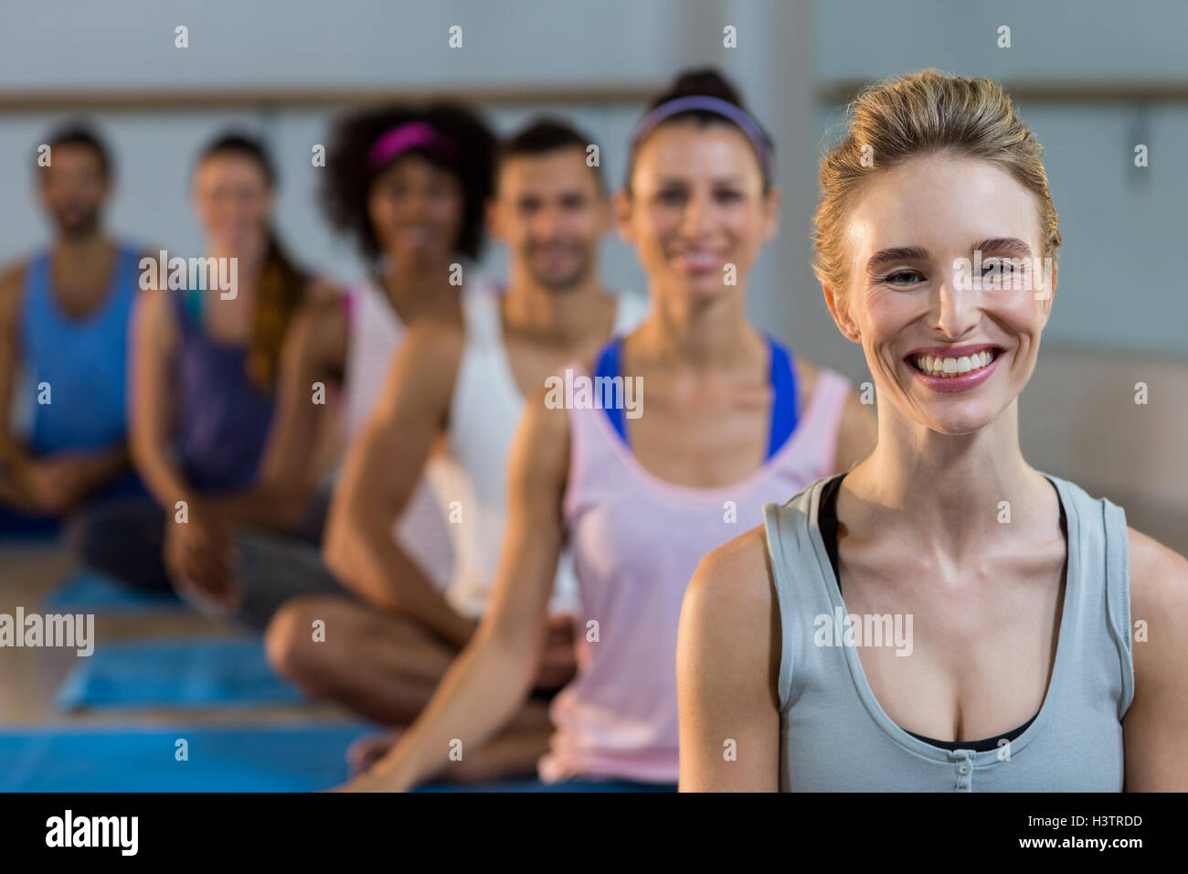 Group of people performing yoga Stock Photo - Alamy
