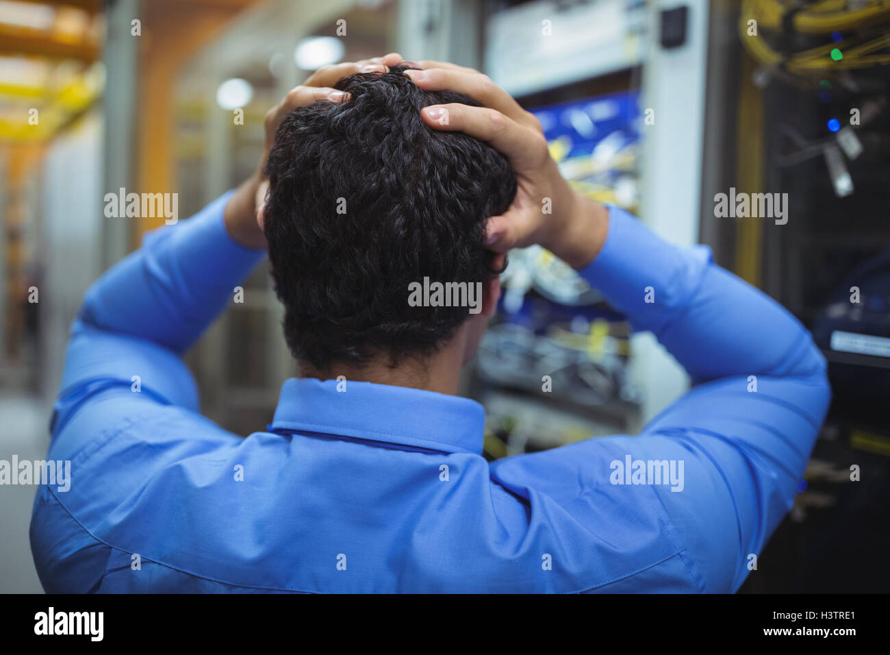 Stressed technician working on server maintenance Stock Photo - Alamy