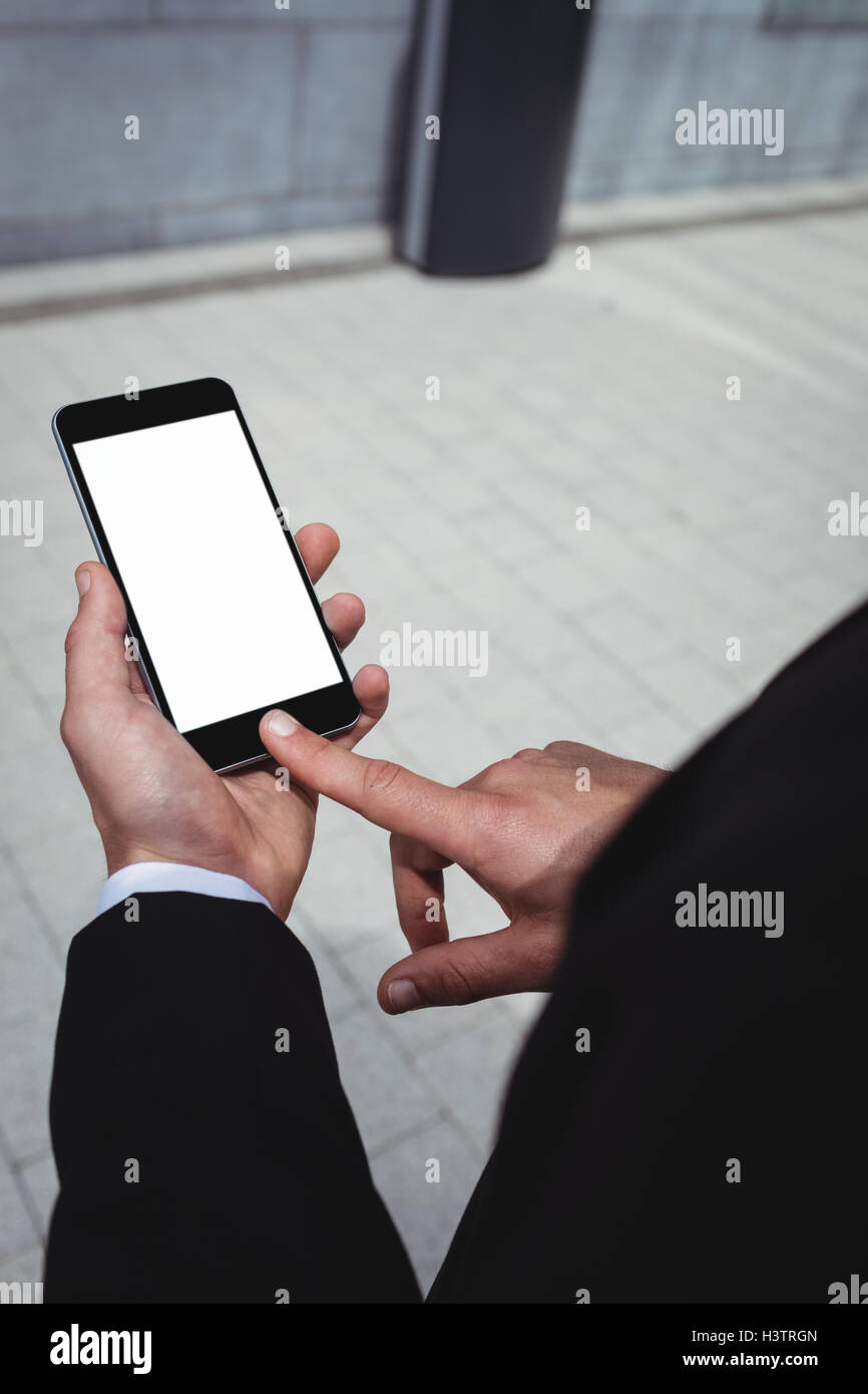 Businessman using mobile phone Stock Photo - Alamy