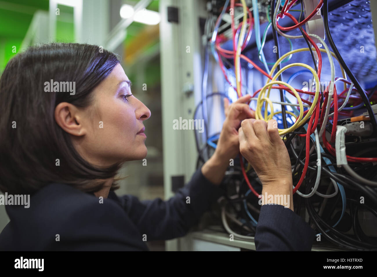 Technician fixing cable Stock Photo - Alamy Technician fixing cable Stock Photo - Alamy