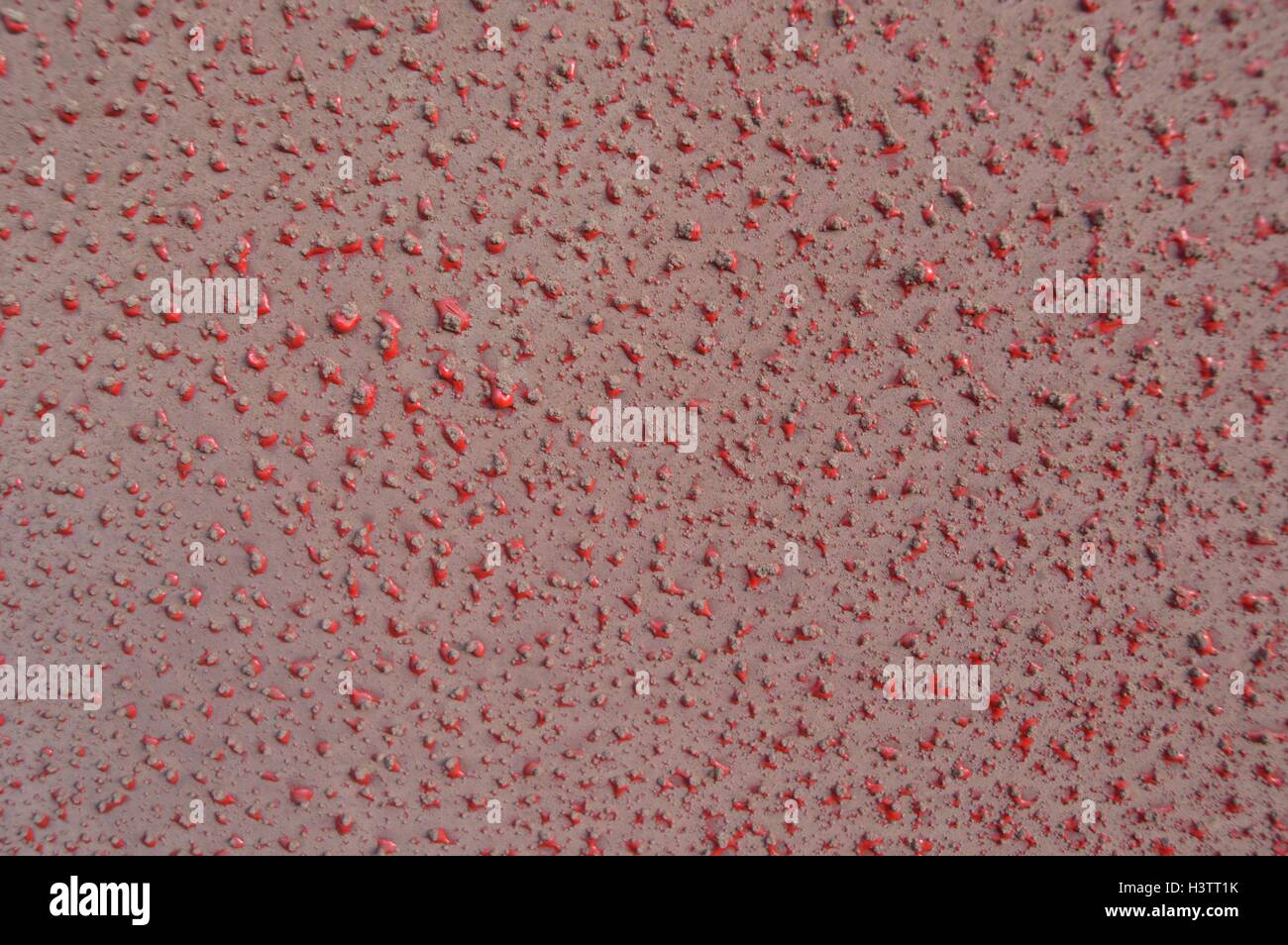 Sheet metal with red dots. Photo of a sheet metal with a red background ...