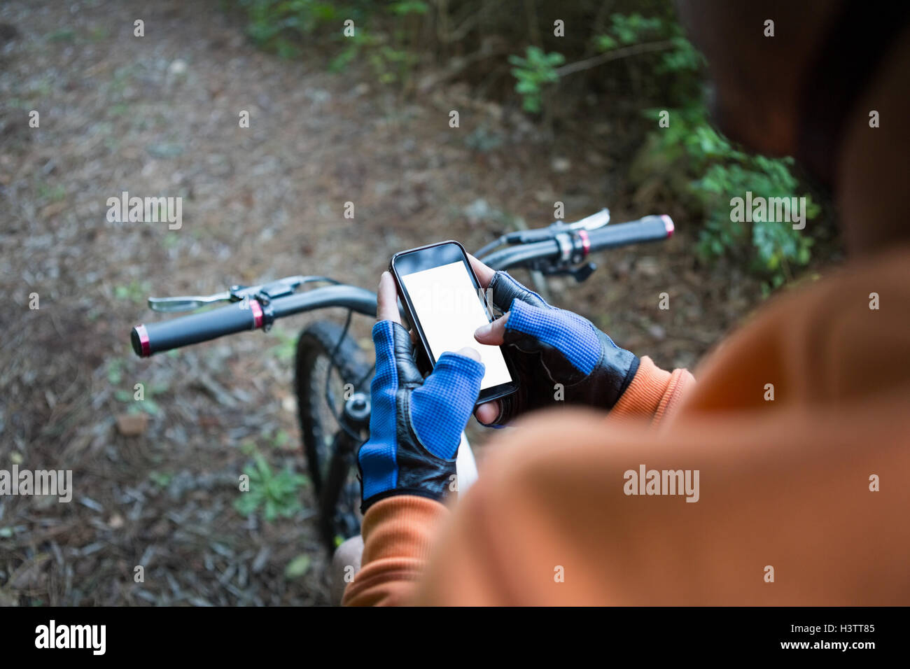 Male biker using smart hi-res stock photography and images - Alamy