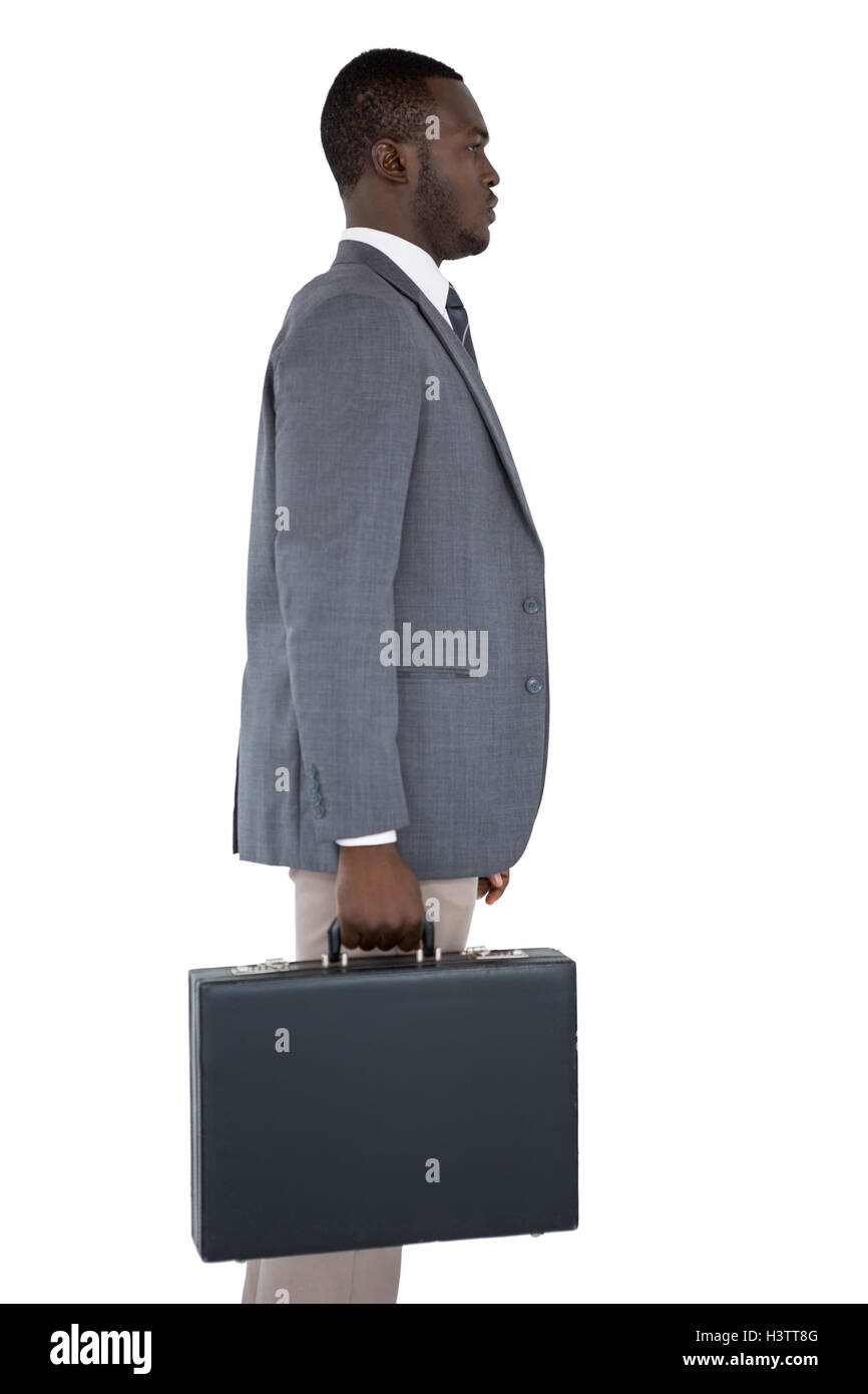 Businessman holding a briefcase Stock Photo - Alamy