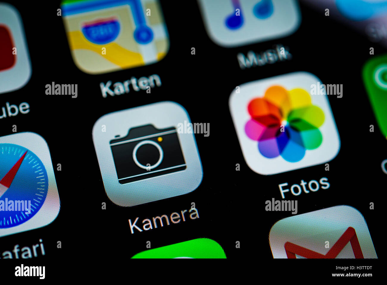 Smartphone screen displaying Maps, Photos, and Camera Apps in detail ...