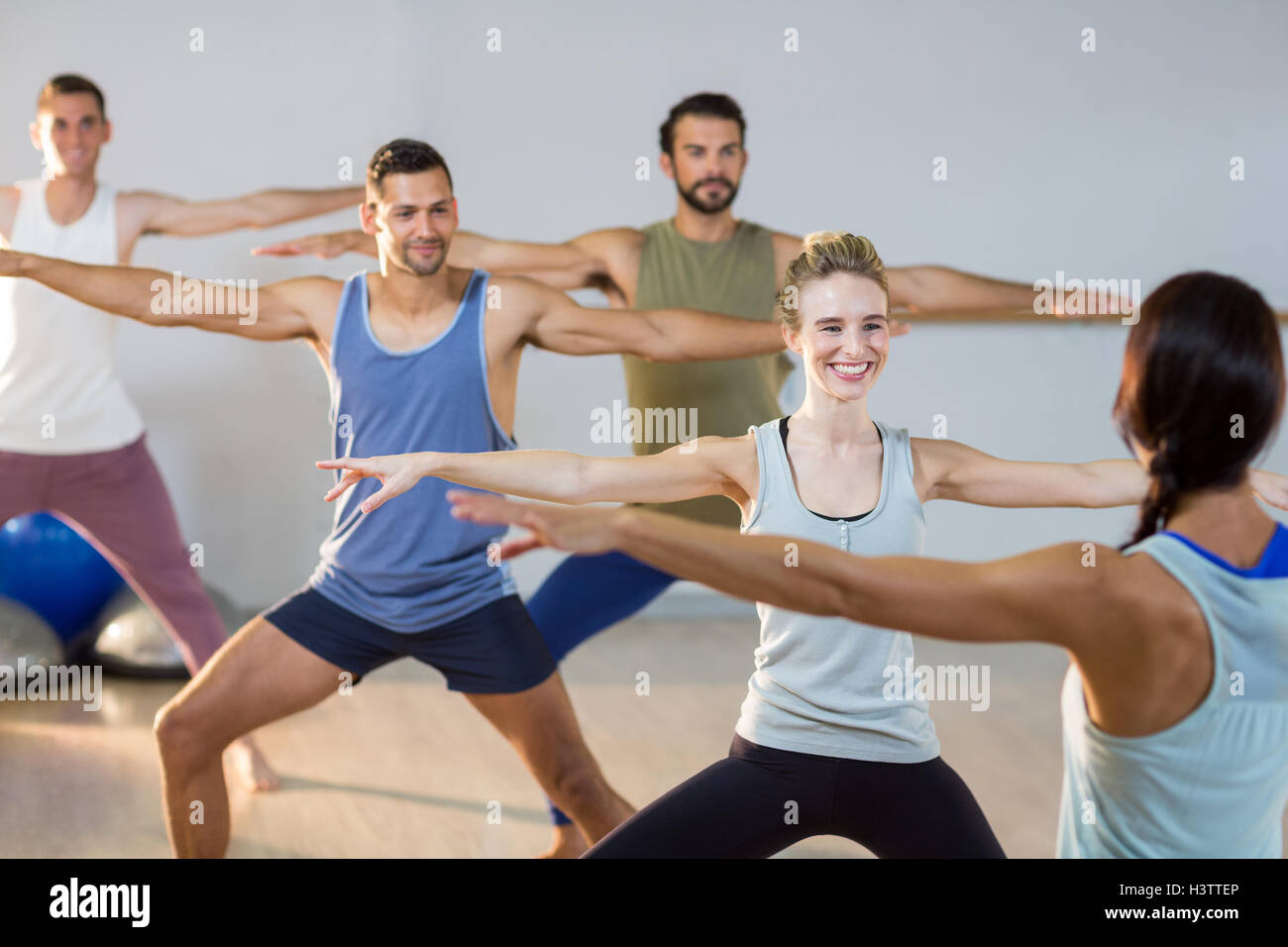Instructor taking yoga class Stock Photo - Alamy