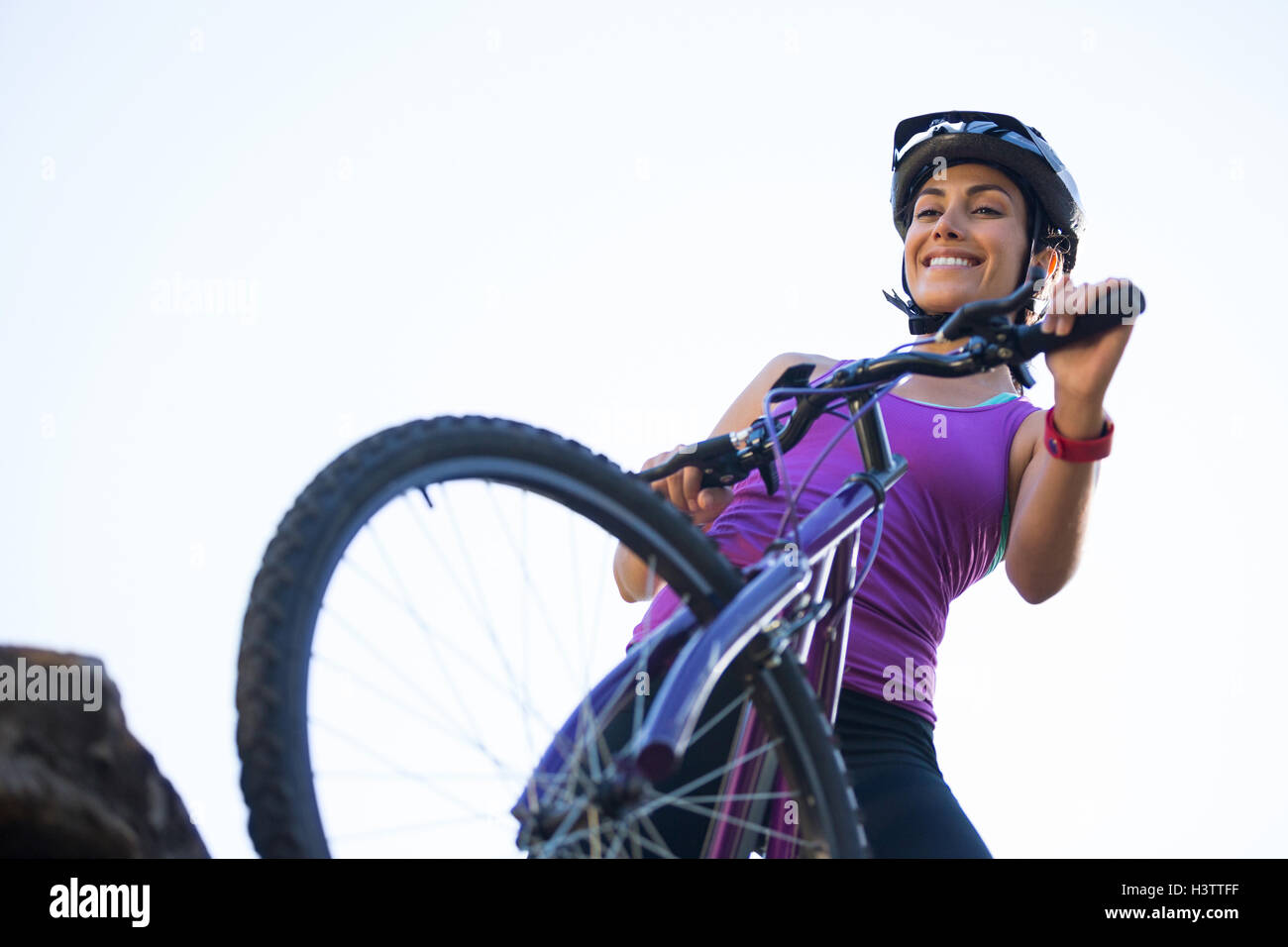 Cheerful young female cyclist hi-res stock photography and images - Alamy