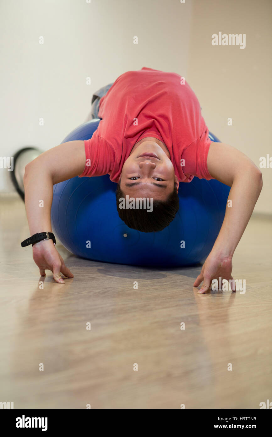 Man exercising on exercise ball Stock Photo - Alamy