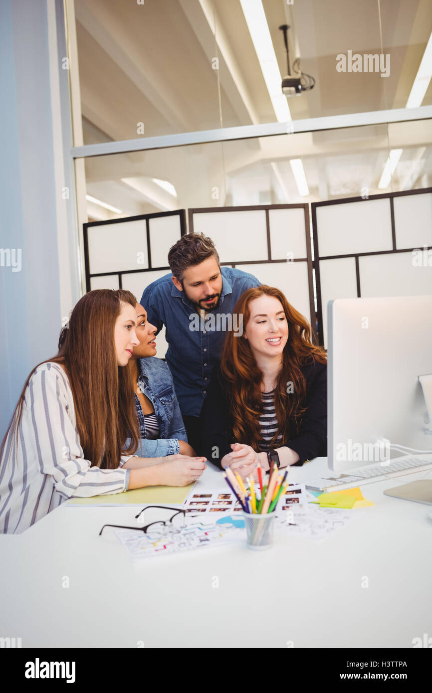 Business people using computer in meeting room Stock Photo - Alamy