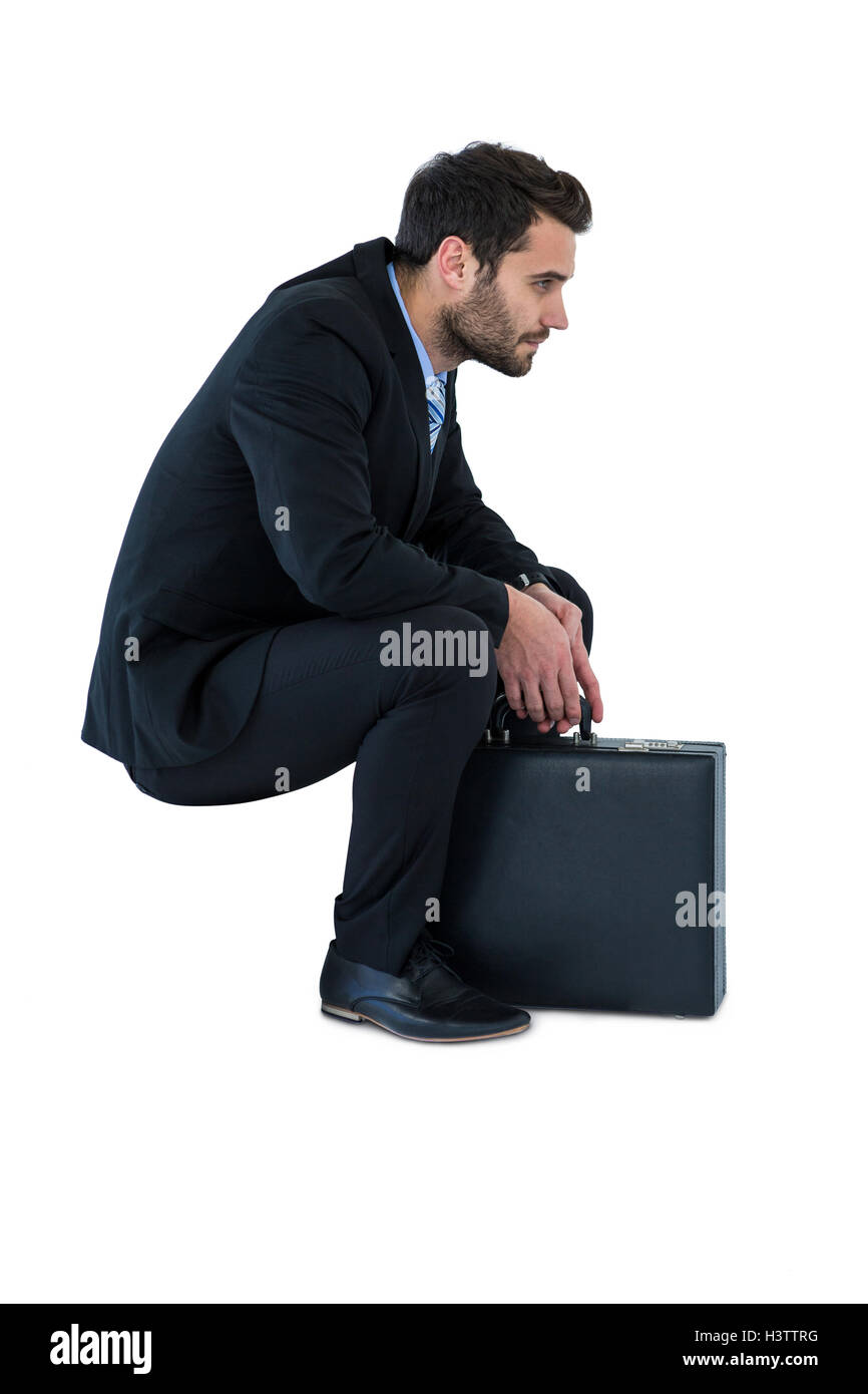 Businessman sitting on steps Stock Photo - Alamy