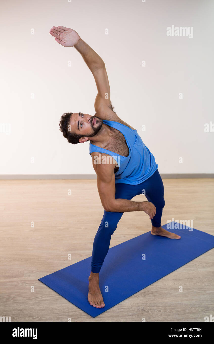 Man performing stretching exercise Stock Photo - Alamy