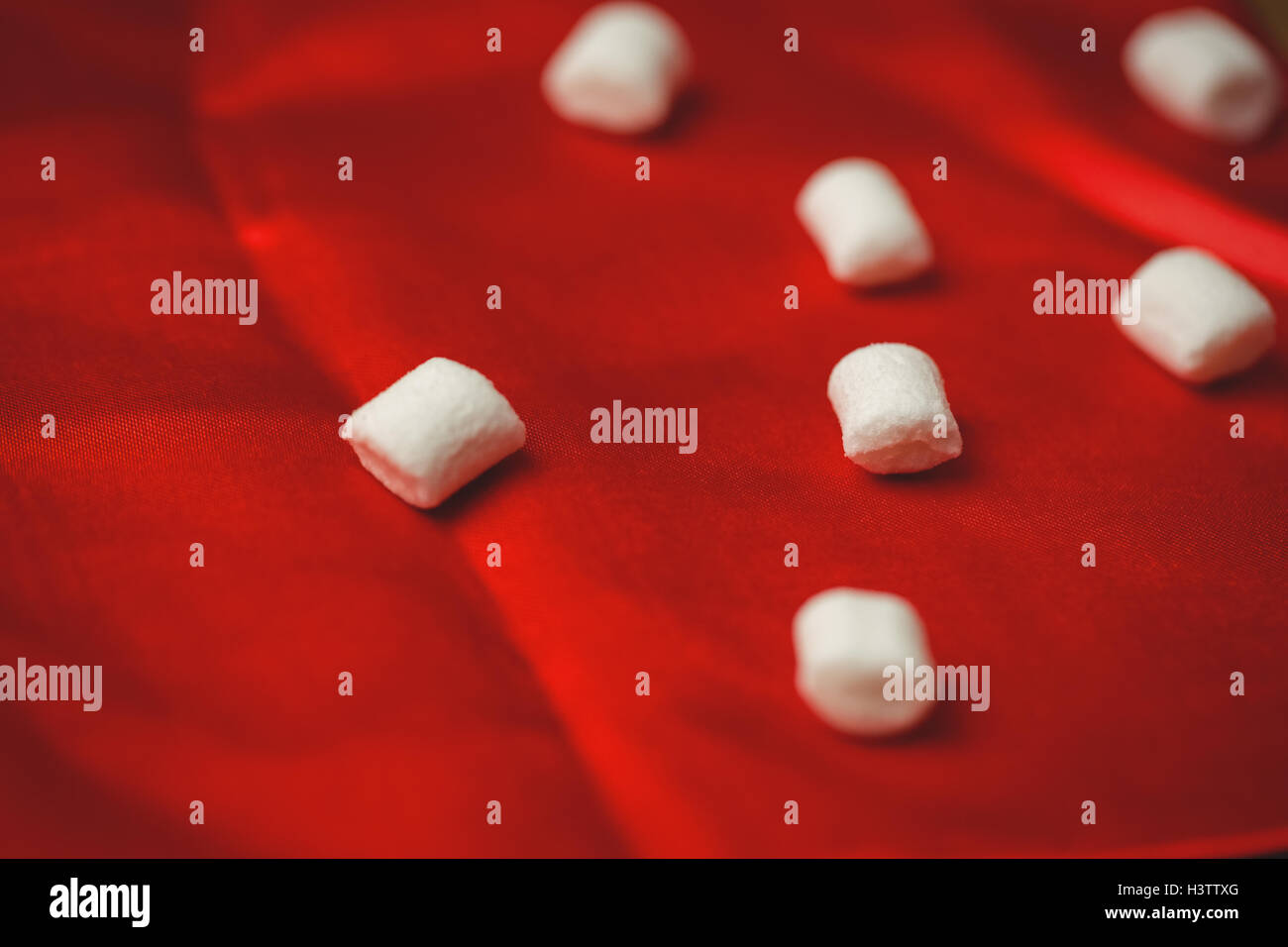 Sweet marshmallow on red cloth Stock Photo - Alamy