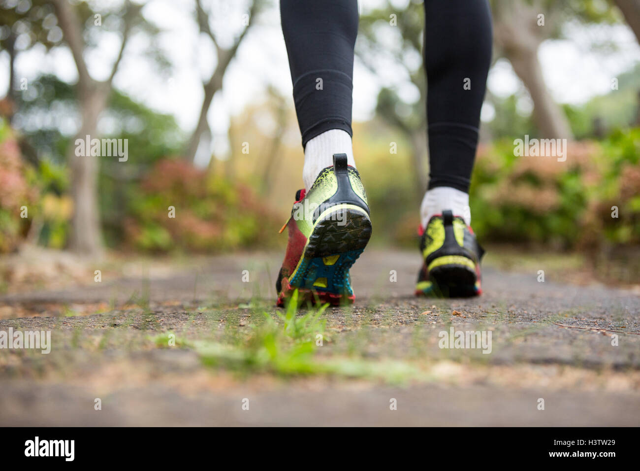 Feet of jogger jogging Stock Photo - Alamy