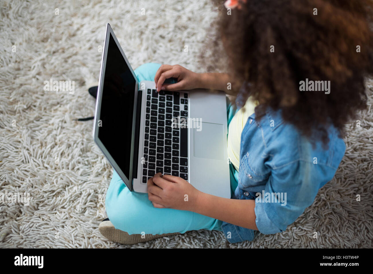 Girl using laptop Stock Photo - Alamy
