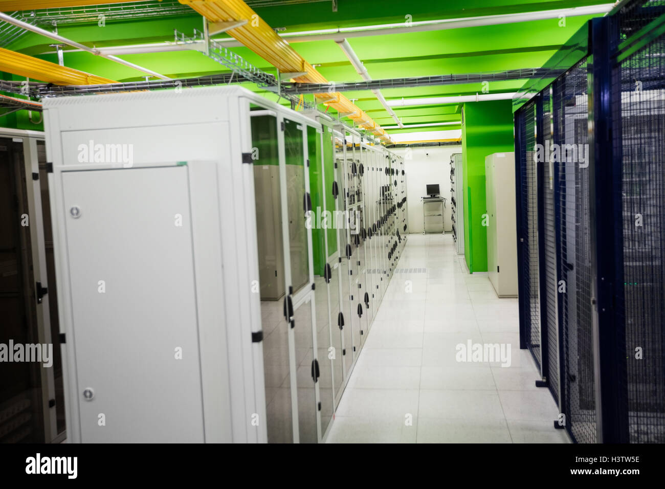 Hallway with a row of servers Stock Photo - Alamy