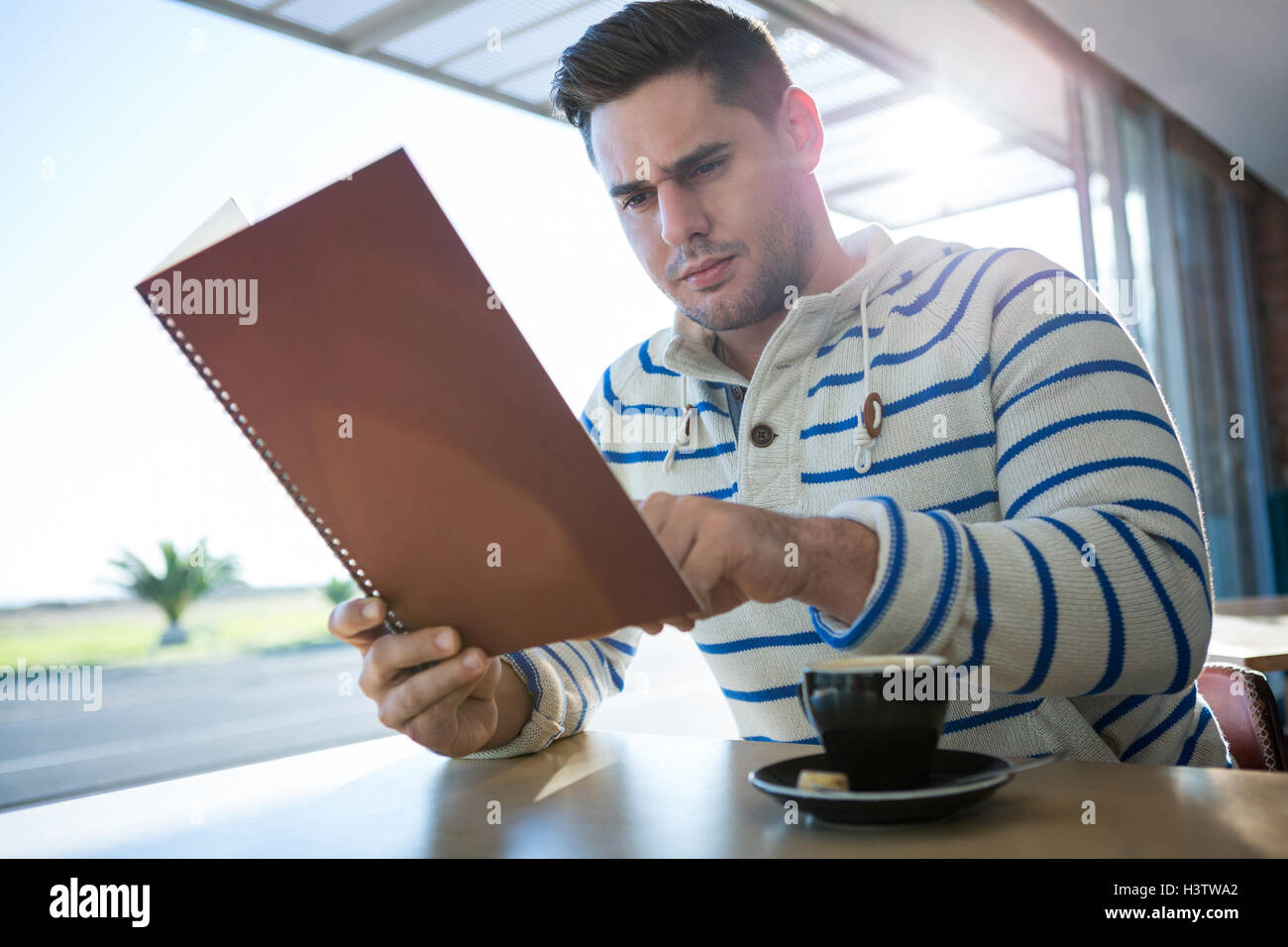 Checking the menu hi-res stock photography and images - Alamy