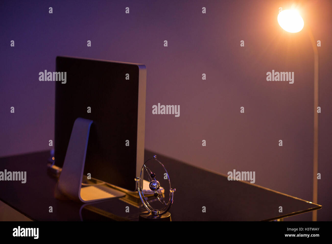 Close-up computer monitor and illuminated lamp Stock Photo - Alamy