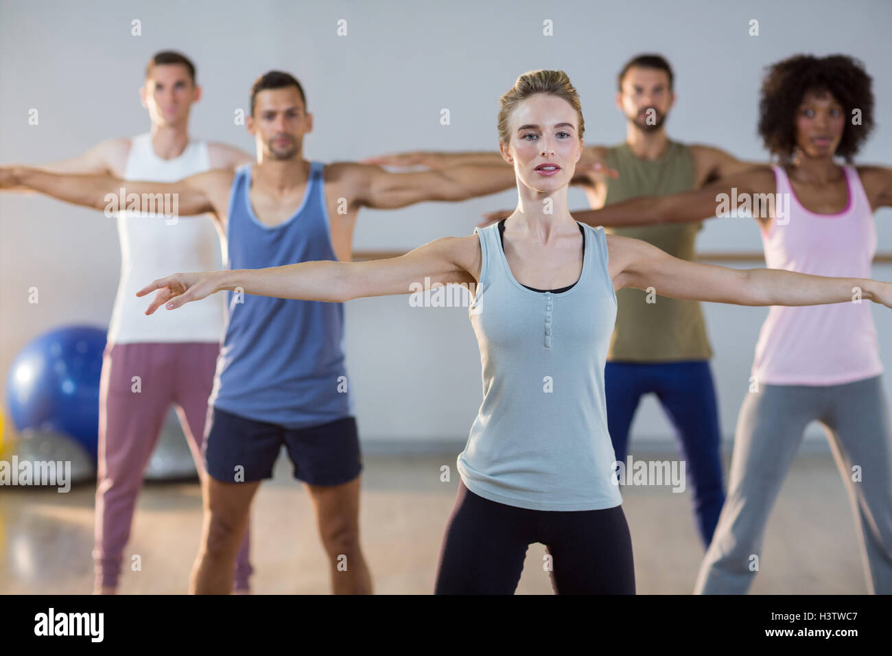 Group of people performing exercise Stock Photo - Alamy