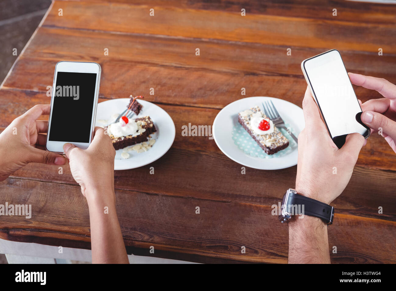 Hands taking photograph of dessert Stock Photo - Alamy
