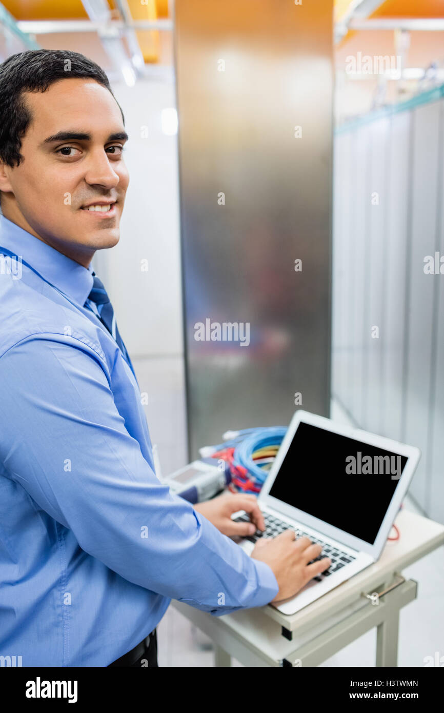 Portrait of technician working on laptop Stock Photo - Alamy