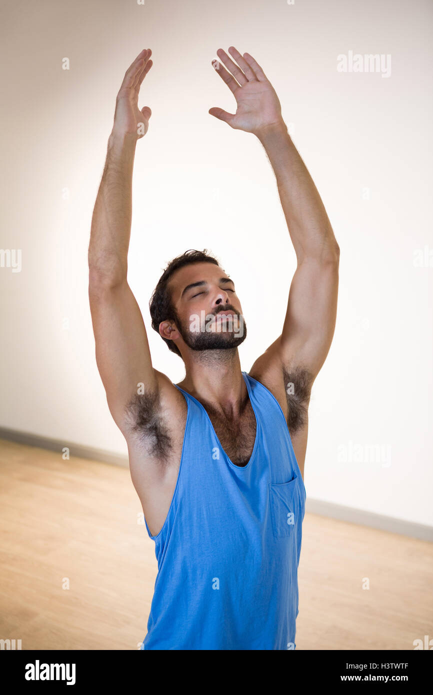 Man performing stretching exercise Stock Photo - Alamy