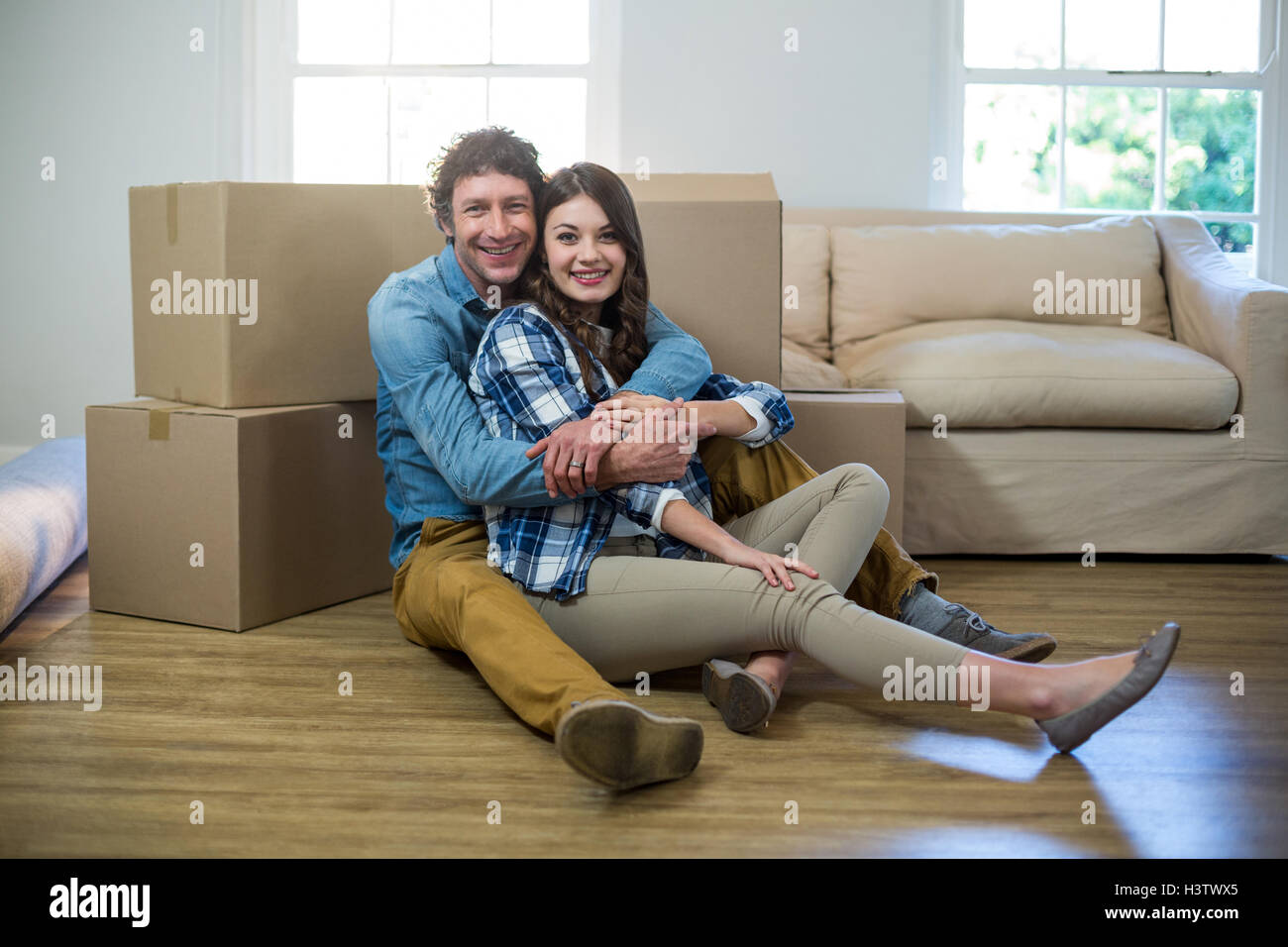 Female sitting on floor hi-res stock photography and images - Alamy