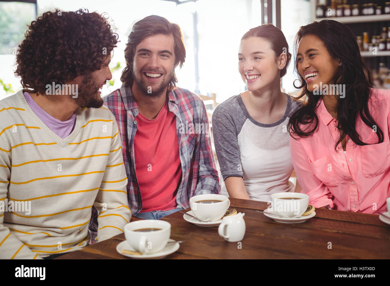 Group of friends having cup of coffee Stock Photo - Alamy