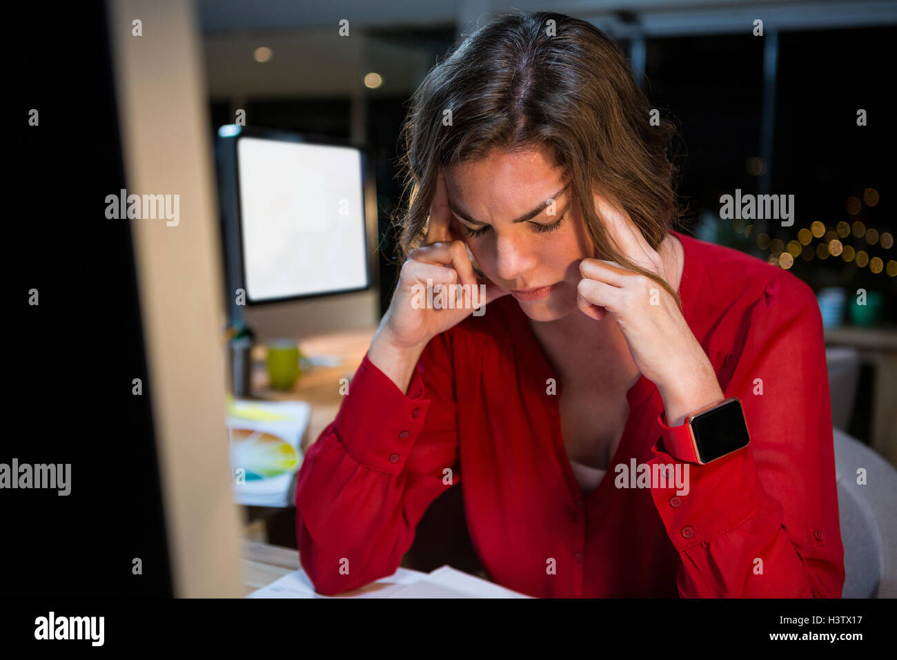 Stressed businesswoman sitting in front of computer Stock Photo - Alamy