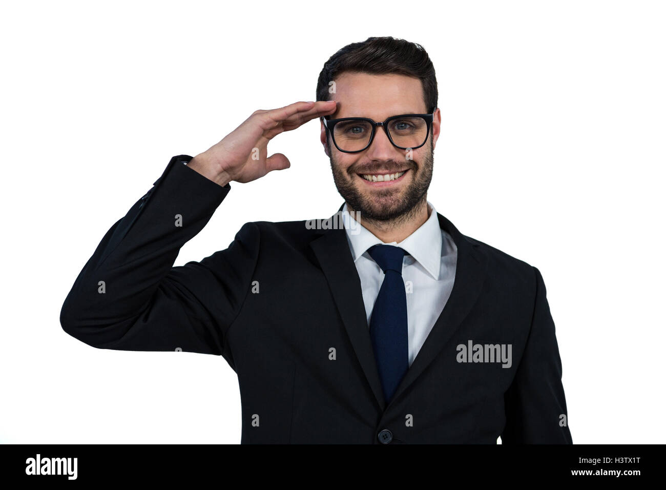 Businessman saluting against white background Stock Photo - Alamy