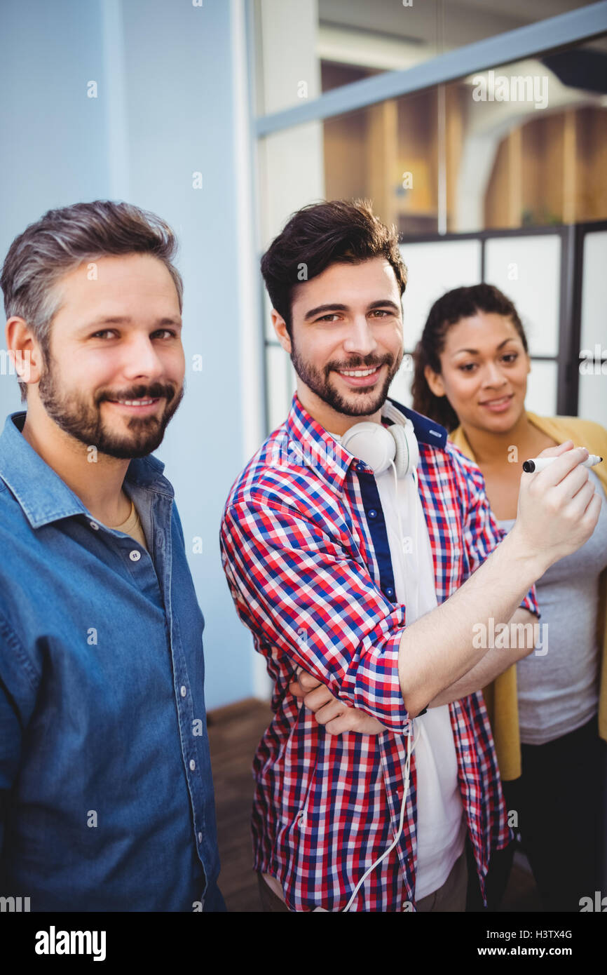 Portrait of confident business partners at creative office Stock Photo ...