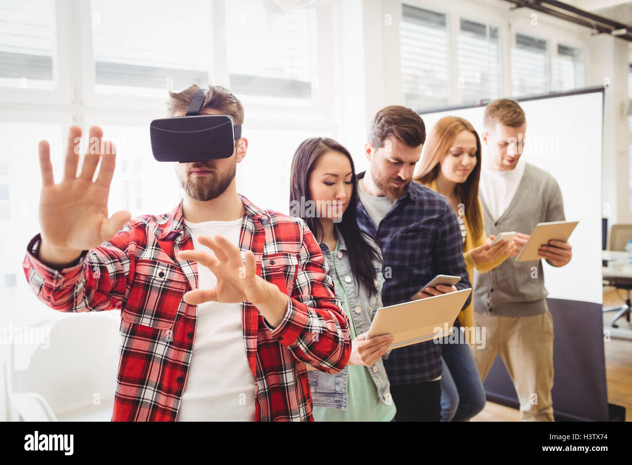 Creative business people using technologies Stock Photo - Alamy