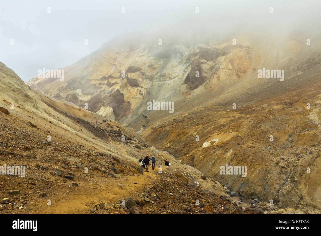 Climbing to active volcano Mutnovsky on Kamchatka Stock Photo - Alamy