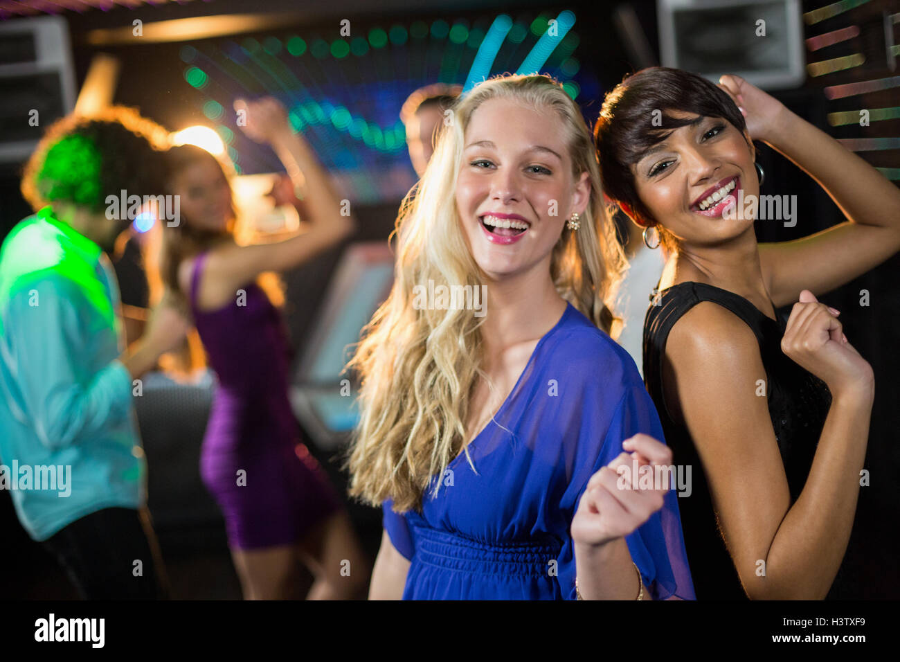 Two beautiful women dancing on dance floor Stock Photo - Alamy