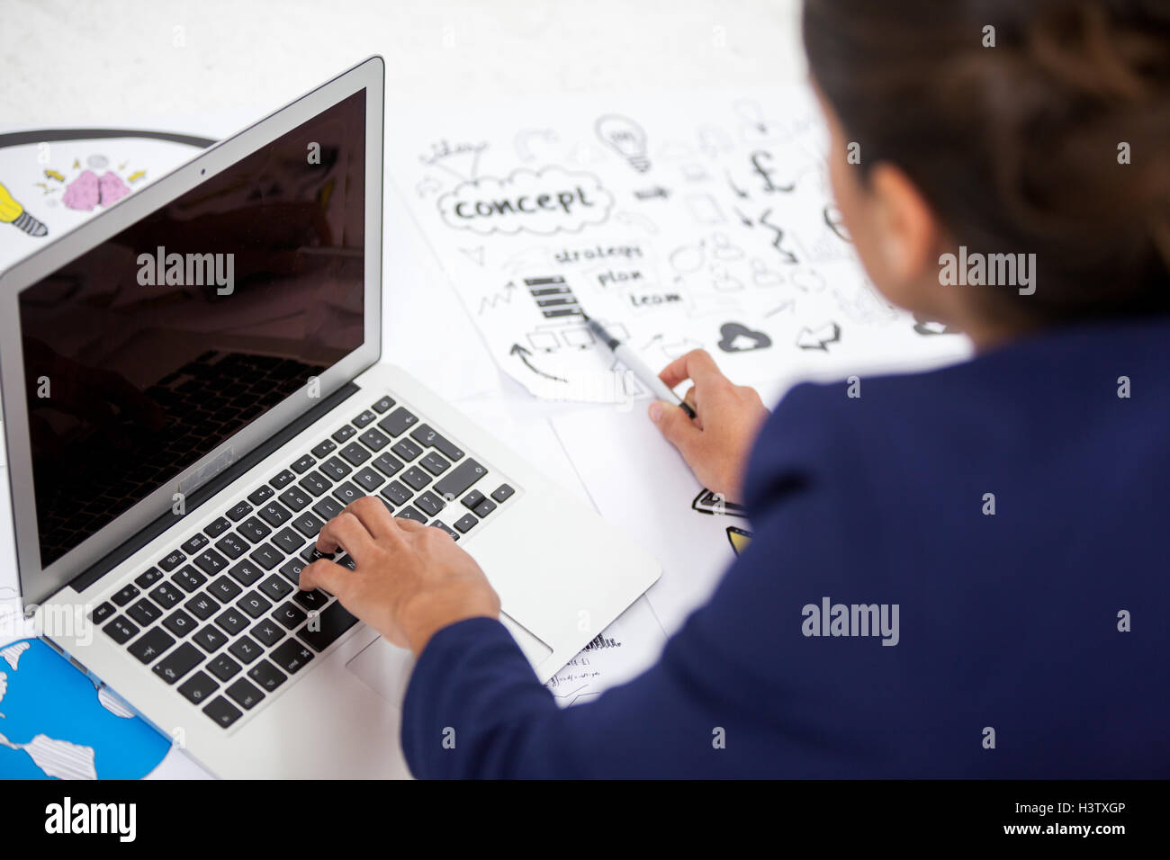 Businesswoman using a laptop Stock Photo - Alamy