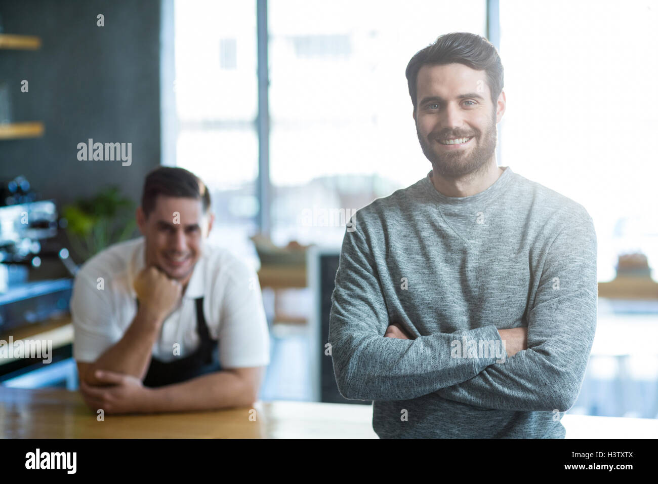 Man standing at counter hi-res stock photography and images - Alamy